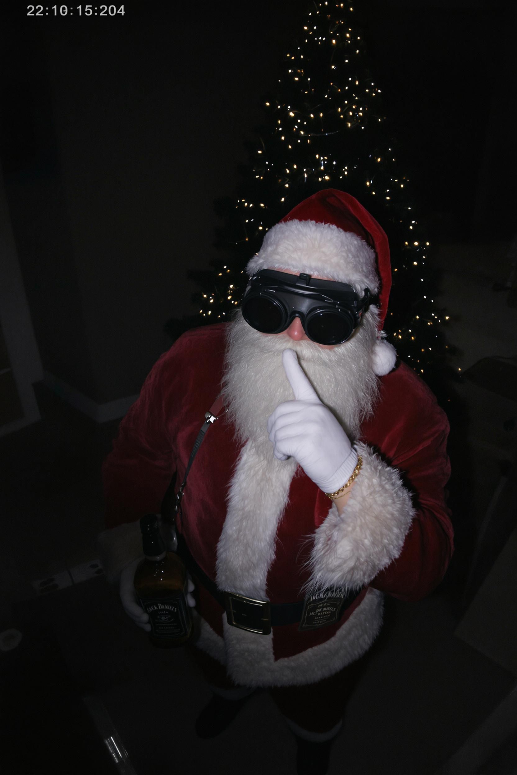Lexica - A dark grainy security camera footage photo of Santa Claus ...